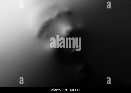 Screaming human face pressing through fabric as horror background Stock ...