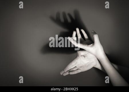 Shadow of hands like deer on light background, closeup with space for ...