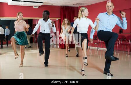Couples enjoying active boogie-woogie Stock Photo - Alamy