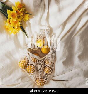 Cup of fresh lemons on light background Stock Photo - Alamy