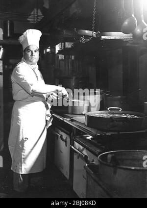 In the kitchen in the 1940s. Interior of a restaurant kitchen and a ...
