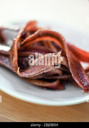 anchovy fillets on a plate Stock Photo - Alamy
