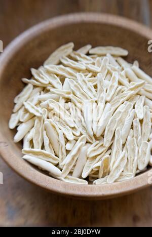 Raw cicatelli pasta shapes on wooden surface Stock Photo - Alamy