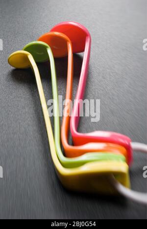 Set of brightly coloured melamine plastic measuring spoons Stock Photo ...