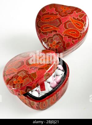 Valentines Day gift boxes with heart on white wooden background, top ...