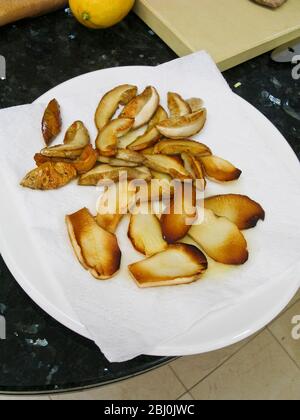 Slices of ceps quickly fried in hot olive oil Stock Photo - Alamy