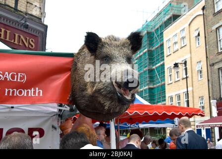 Stuffed boar's head on stall at Whitecross Street market, London EC1 ...
