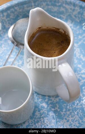 Real coffee made simply in jug with tea strainer Stock Photo - Alamy