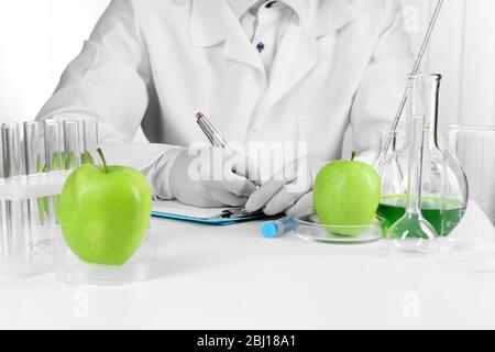Scientist examines apples in laboratory Stock Photo - Alamy