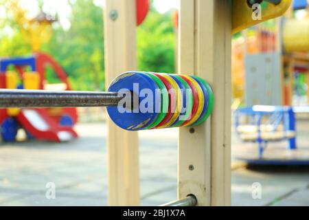 Colorful wooden rings for counting on children playground in park Stock ...