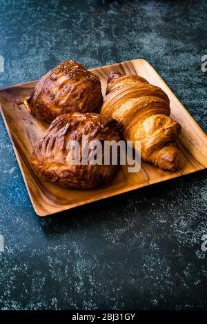 Assortment of Assorted Croissant Varieties om Wooden Plate / Variety of ...