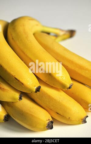 Raw Yellow Organic Bananas in a Bunch Stock Photo - Alamy