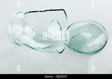 Shattered glass jar isolated on white Stock Photo - Alamy