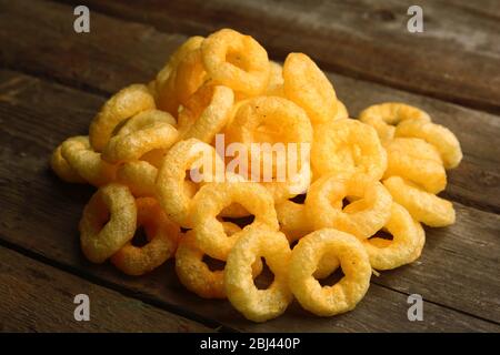 Chips rings on wooden background Stock Photo - Alamy