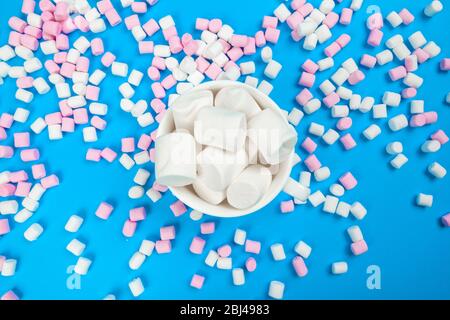 Colorful marshmallow laid out on lime paper background. pastel creative ...