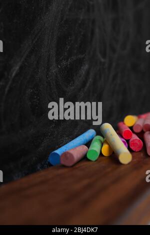 Many chalks on desk background Stock Photo - Alamy