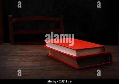 Few books with pencils on table Stock Photo - Alamy