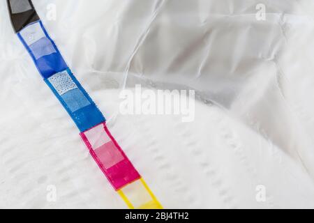 Colour registration strip on plastic packaging. For CMYK process ...
