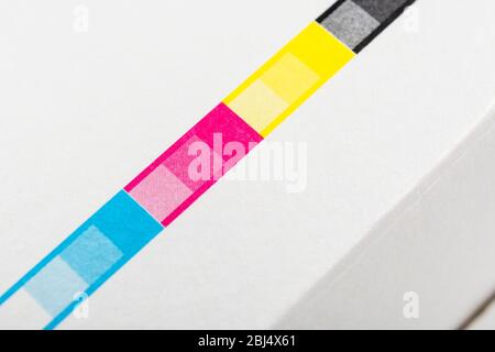 Colour registration strip on paper packaging. For CMYK process colours ...