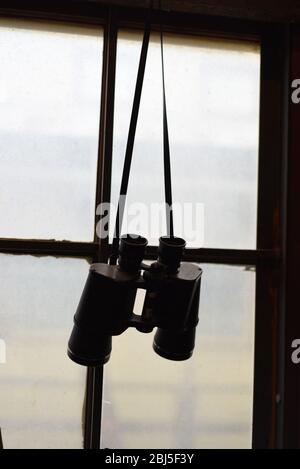 Binoculars in a window. Concept of spying technology. Spy gear ...