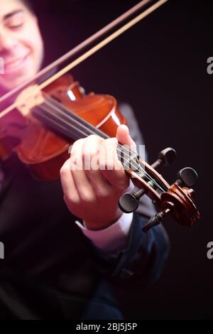 Violinist's performance on black background, close up Stock Photo - Alamy