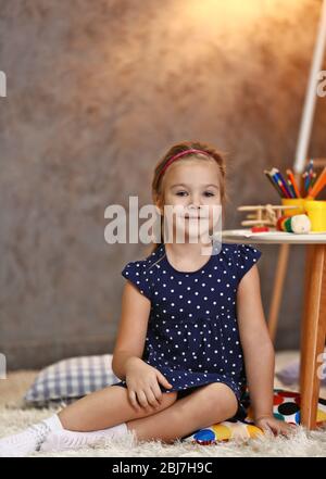 A small, beautiful girl is sitting in car Stock Photo - Alamy