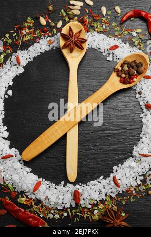 Style clock of spices on wooden table Stock Photo - Alamy