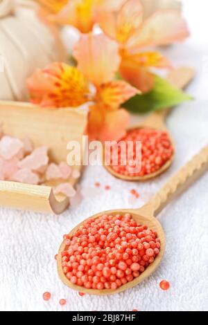 Bowl of sea salt and pink, soft soap on wooden table. Spa time Stock ...