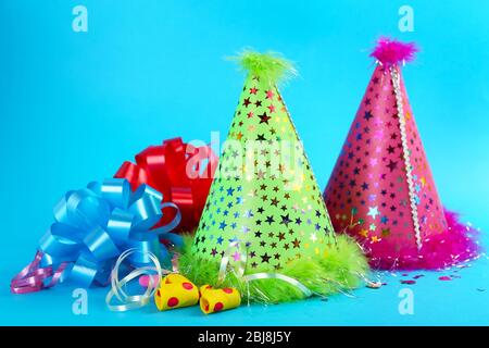 Funny party hats on blue background Stock Photo - Alamy
