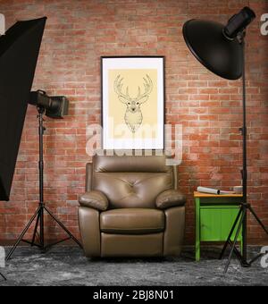 Photo studio interior on brick wall background Stock Photo - Alamy