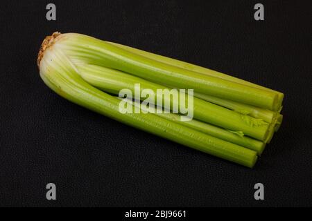 Organic food - celery sticks over wooden background Stock Photo - Alamy