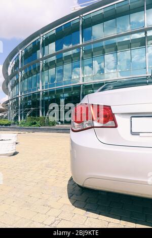 Blue car parked near office building, Modern architecture view with car ...