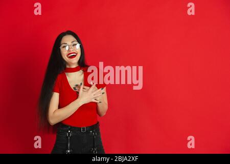 Embarrassed, thankful smiling. Caucasian young woman's monochrome ...