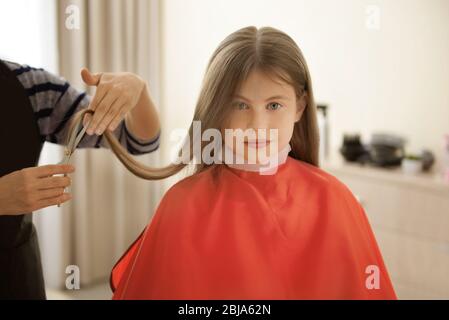 Small girl in hairdressing salon Stock Photo - Alamy