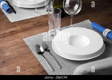 Elegant table appointments with blue napkin Stock Photo - Alamy