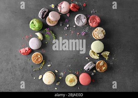 Circle of different colorful macaroons on gray background Stock Photo ...
