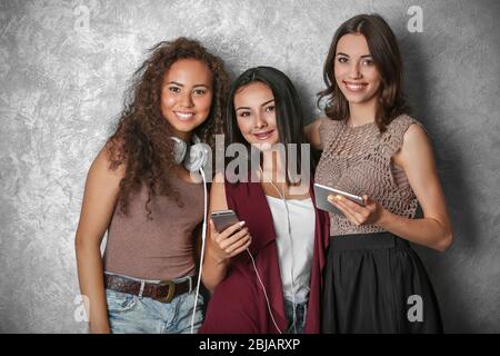 Gadgets on grey background Stock Photo - Alamy