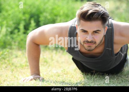 man making push-ups outdoors Stock Photo - Alamy