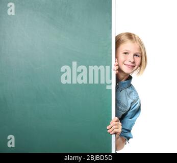 Schoolgirl near green school board. High resolution photo Stock Photo ...