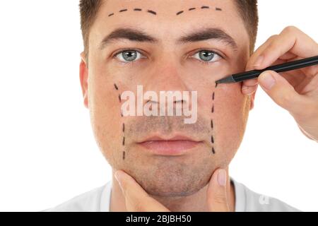 Plastic surgery concept. Hands marking male face Stock Photo - Alamy