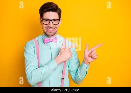Photo of handsome brunet guy directing fingers novelty offer empty ...