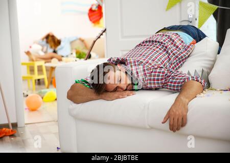 Tired drunk man after party at home with cup coffee Stock Photo - Alamy