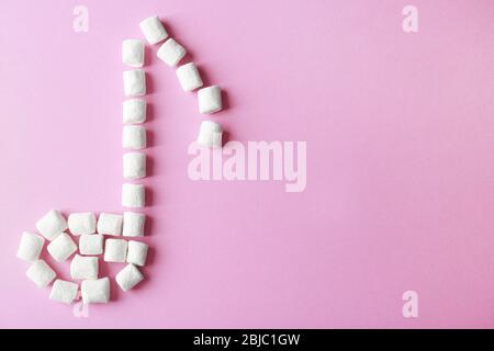 Musical note made of marshmallow on pink background Stock Photo - Alamy