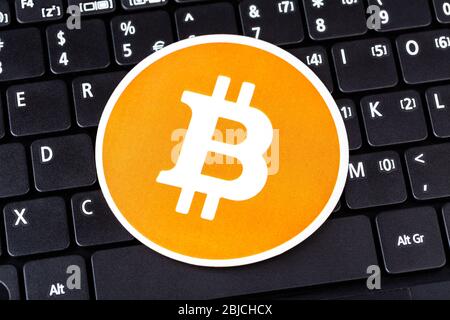 bitcoin on black laptop keyboard Stock Photo - Alamy