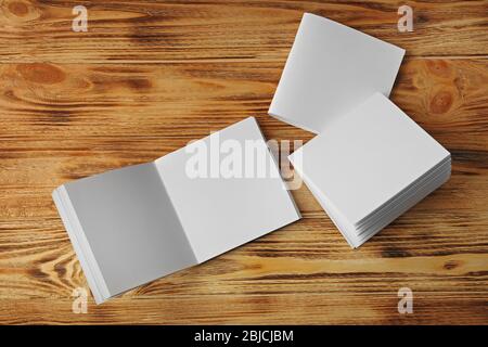 Blank brochures on wooden background Stock Photo - Alamy