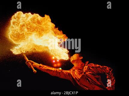 Breathing Fire Circus Spectacular Flame Fire eater blowing interior ...