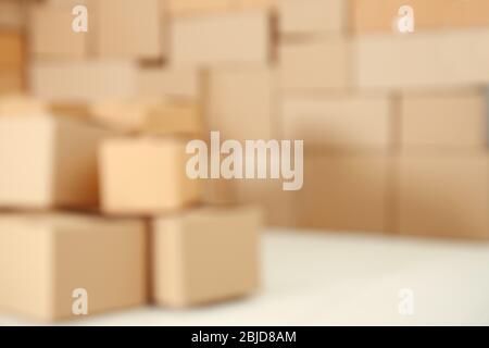 Carton boxes blurred background Stock Photo - Alamy