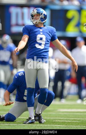 New York Giants kicker Lawrence Tynes (9) is congratulated by holder ...