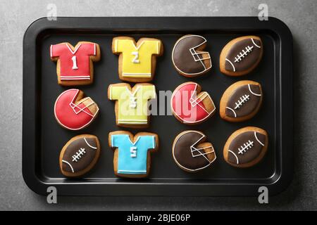 Football cookies on baking tray Stock Photo - Alamy