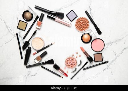 Frame of makeup products and decorative cosmetics on pink background ...